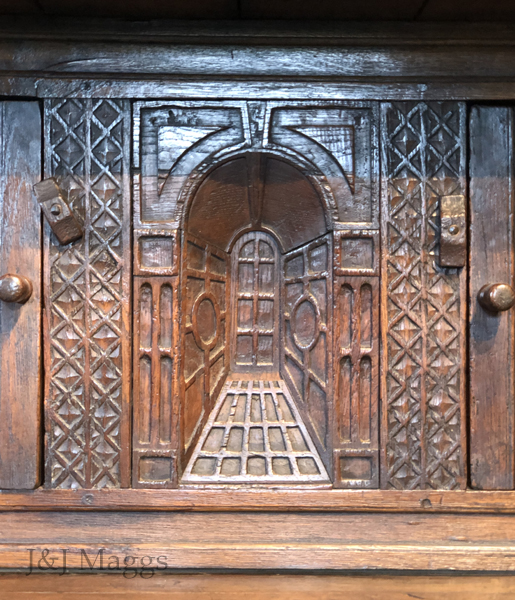 Petite court cupboard with perspective carving and single drawer