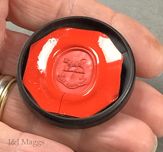 A tiny, rosewood seal box